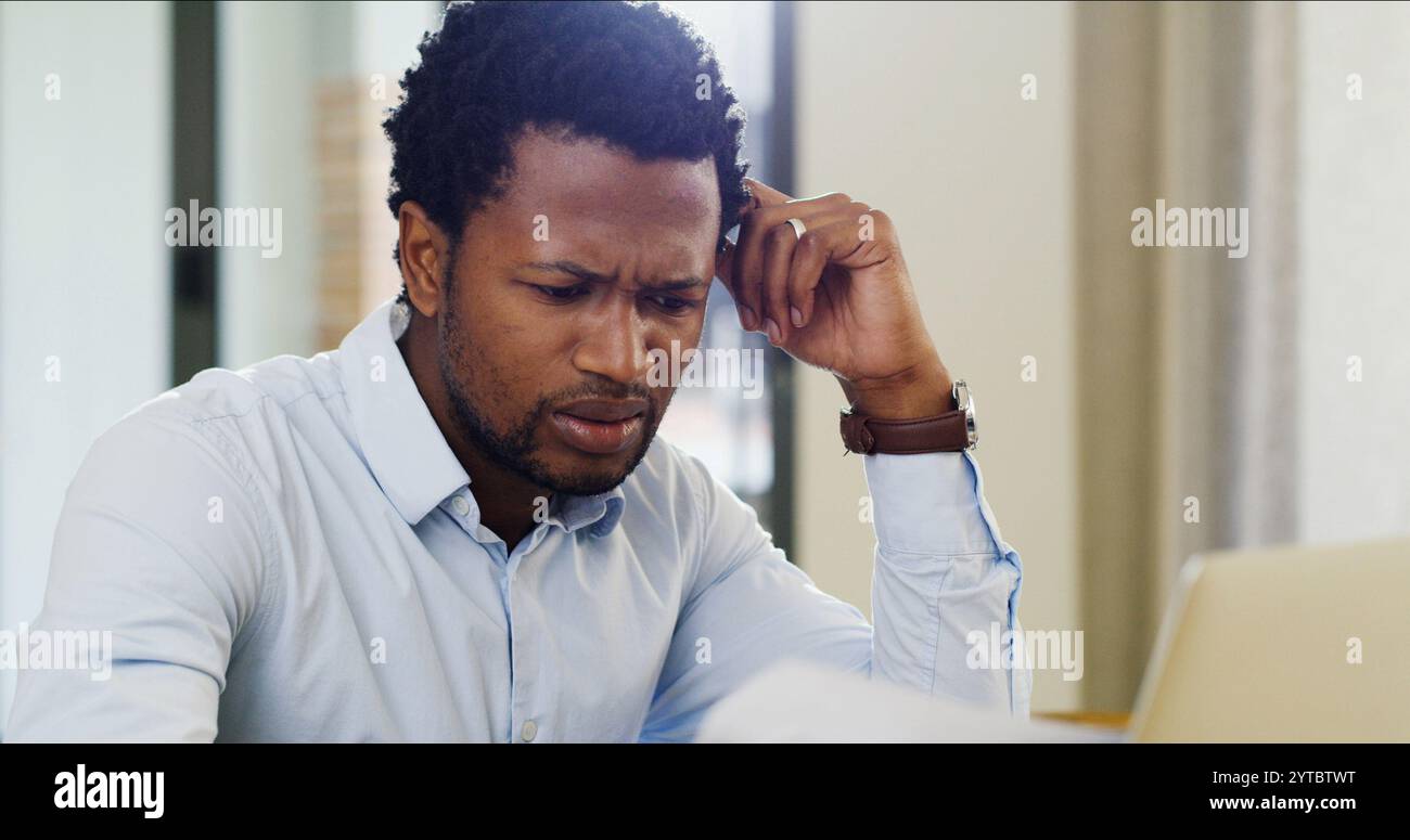 Confused businessman reading documents hi-res stock photography and ...