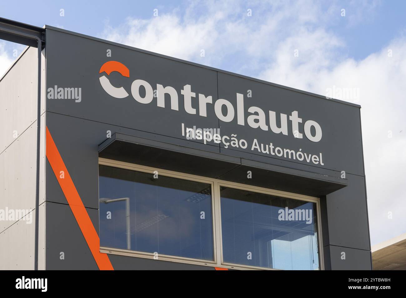 Controlauto logo and sign displayed on a building facade, representing ...