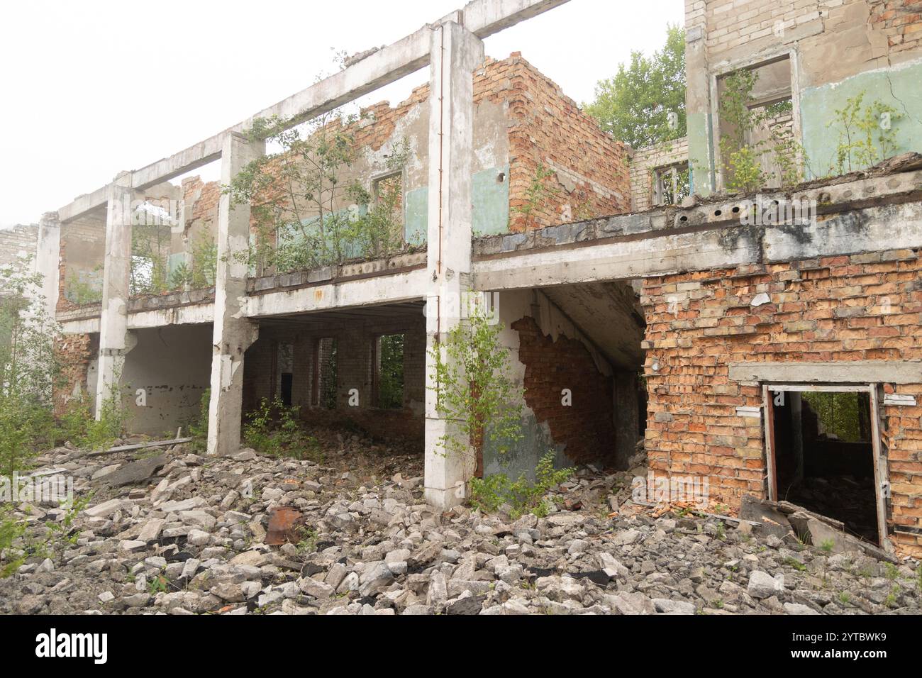 An old, collapsed building of Soviet army base in Latvia, Europe. Red ...