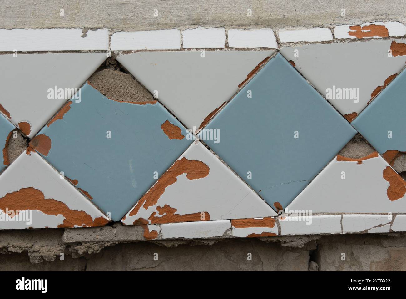 An old enamel tile wall texture. Cracked, abandoned building wall from ...