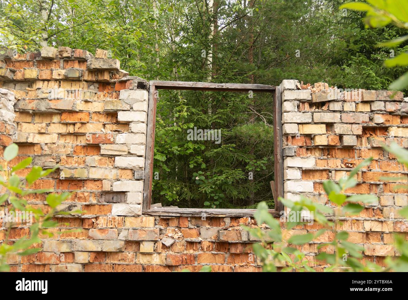 A broken, empty window of building ruins from Soviet times. Collapsed ...
