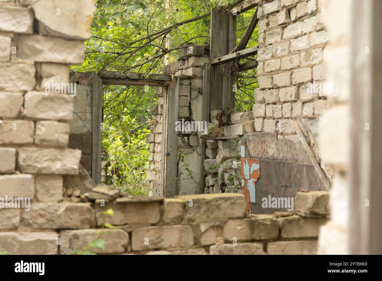 A broken, empty window of building ruins from Soviet times. Collapsed ...