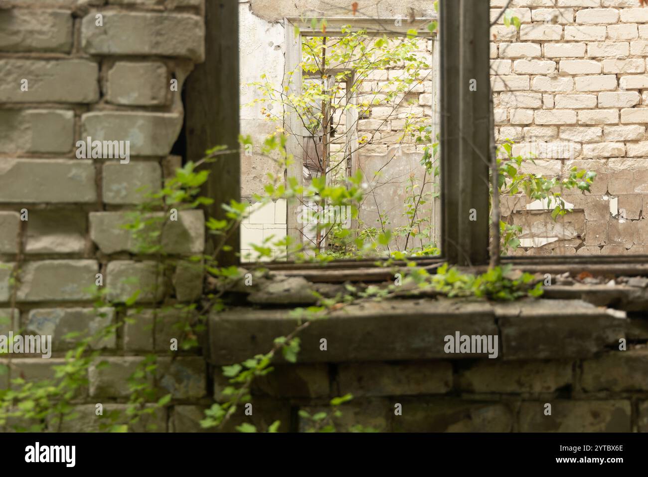 A broken, empty window of building ruins from Soviet times. Collapsed ...