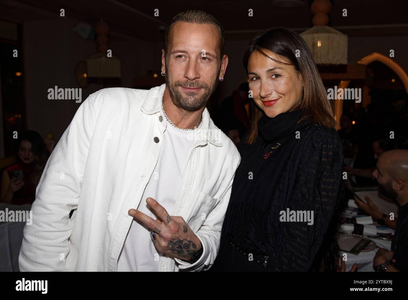 Paris, France. 6th Dec, 2024. Visual artist David Marin and a guest ...