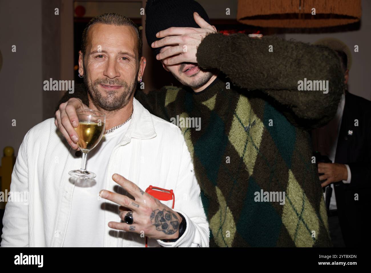 Paris, France. 7th Dec, 2024. Visual artist David Marin and a guest ...