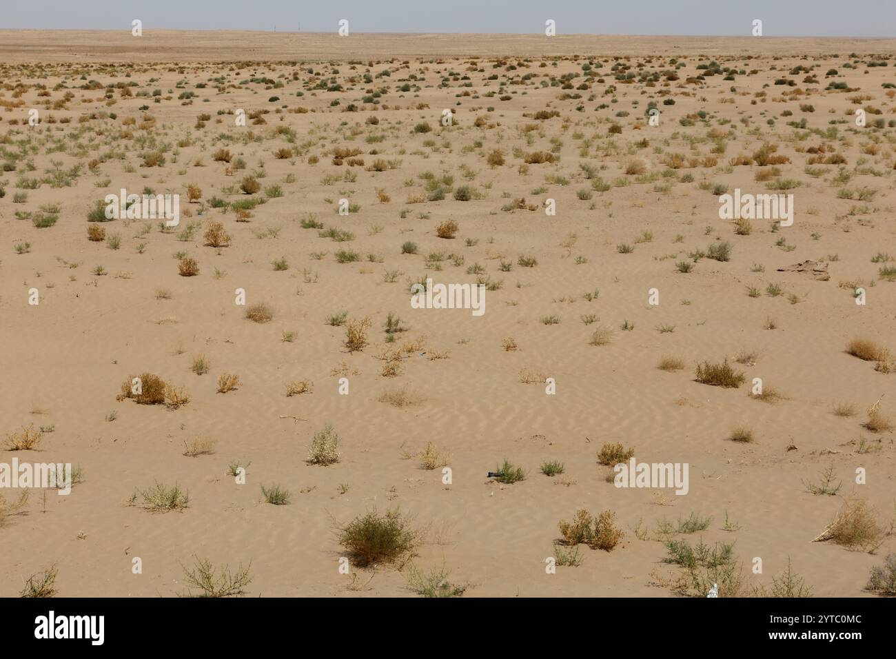A vast desert landscape in Jowzjan Province showcases sandy terrain ...