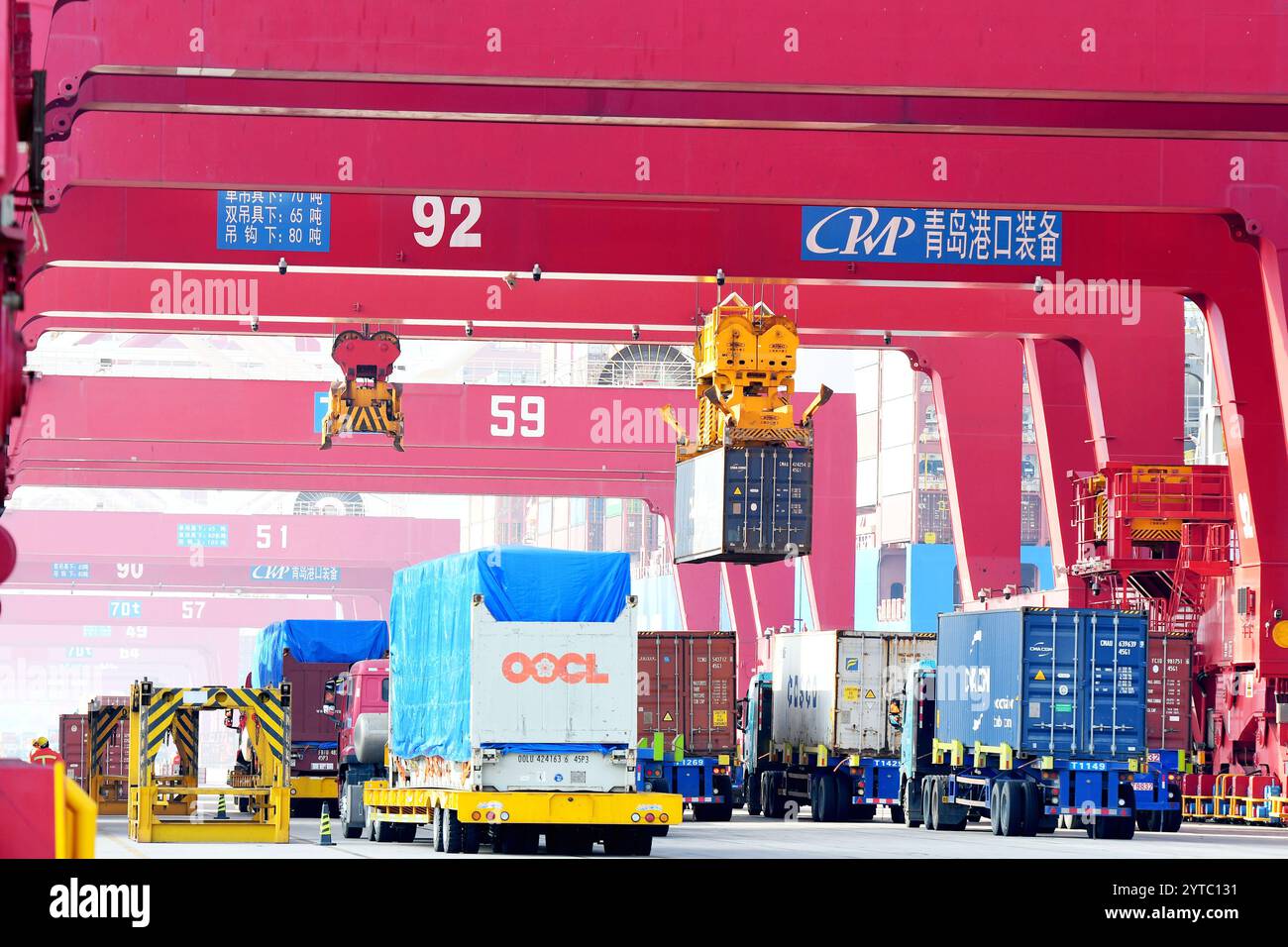 QINGDAO, CHINA - DECEMBER 7, 2024 - Cargo ships load and unload ...
