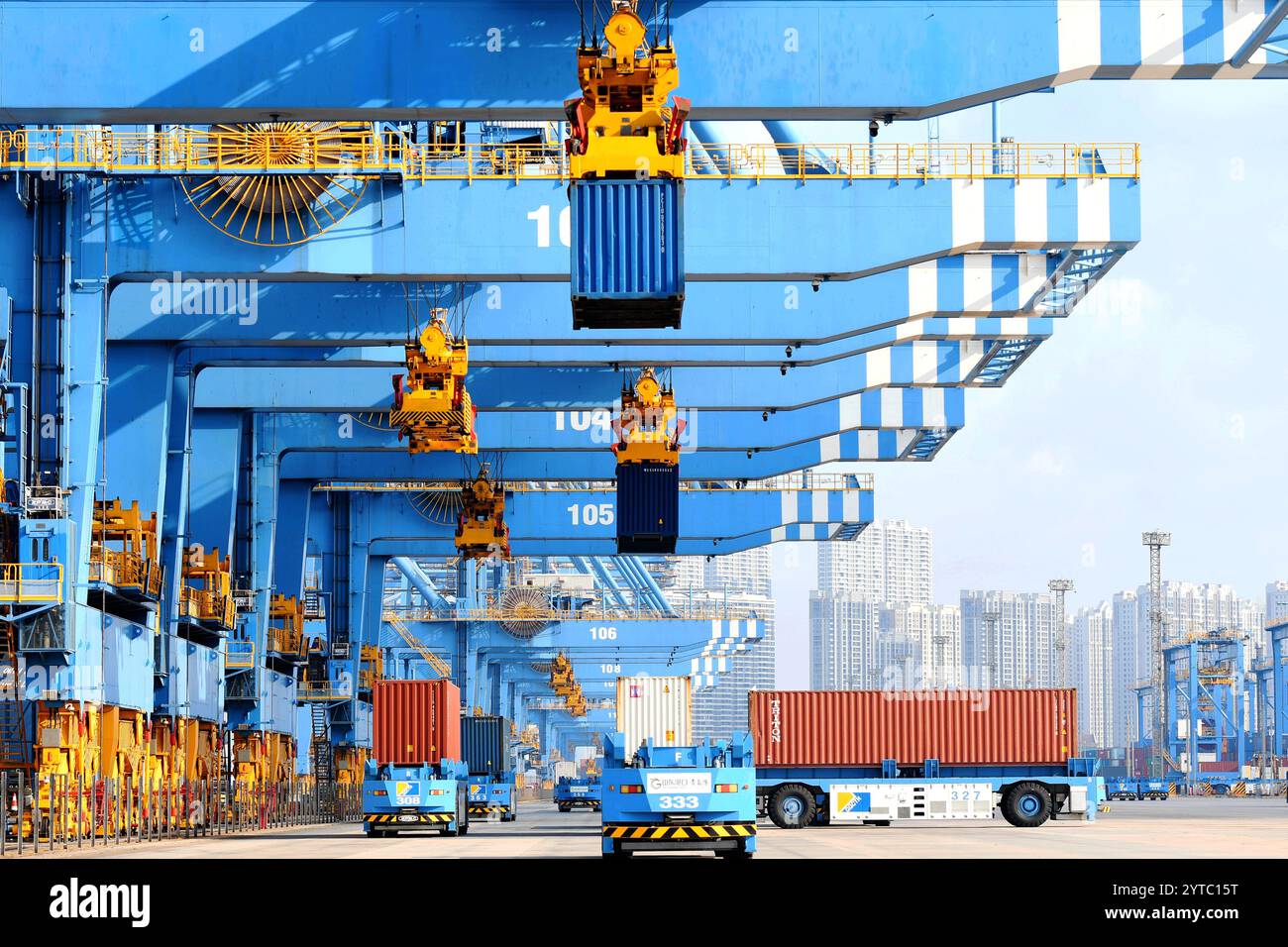 QINGDAO, CHINA - DECEMBER 7, 2024 - Cargo ships load and unload foreign ...