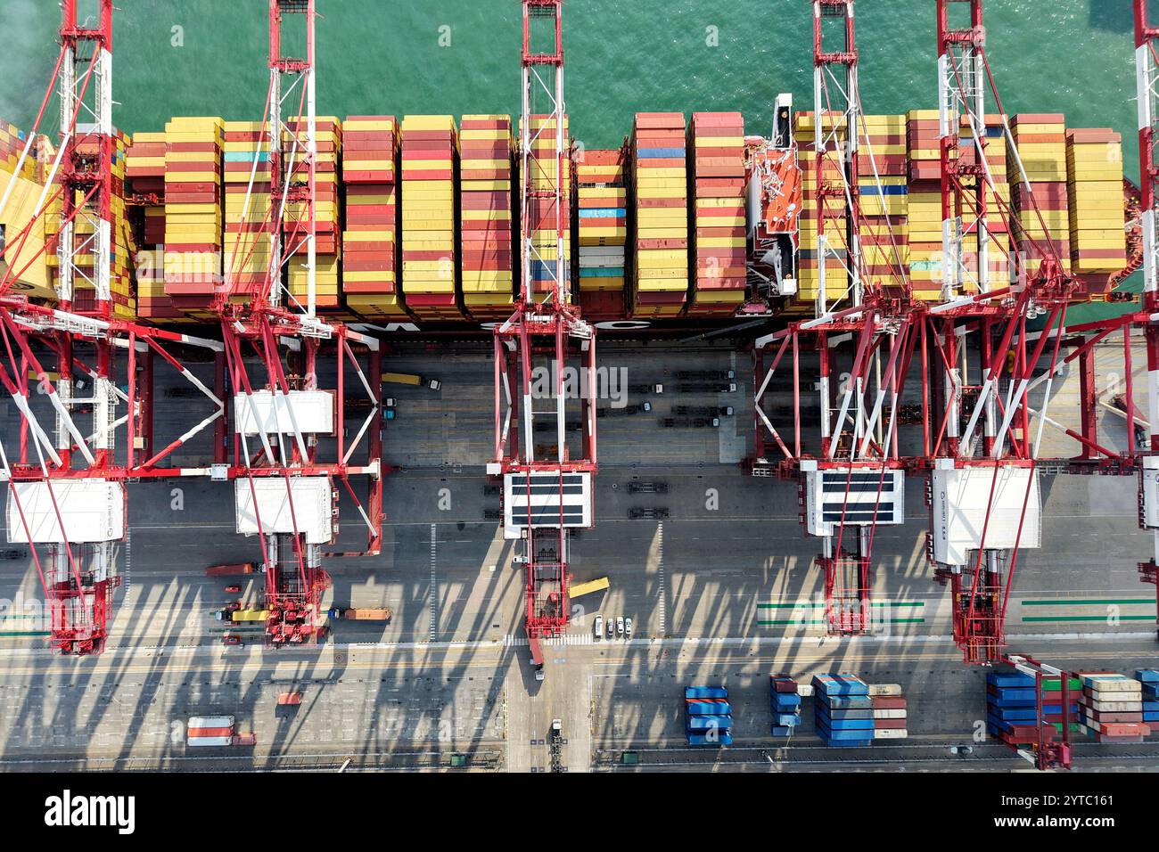 QINGDAO, CHINA - DECEMBER 7, 2024 - Cargo ships load and unload ...
