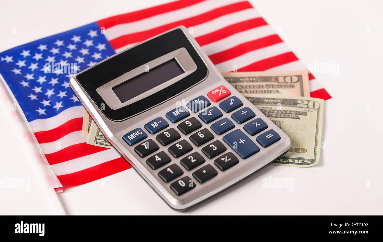 USA American flag, calculator and dollars. Calculating expenses concept ...