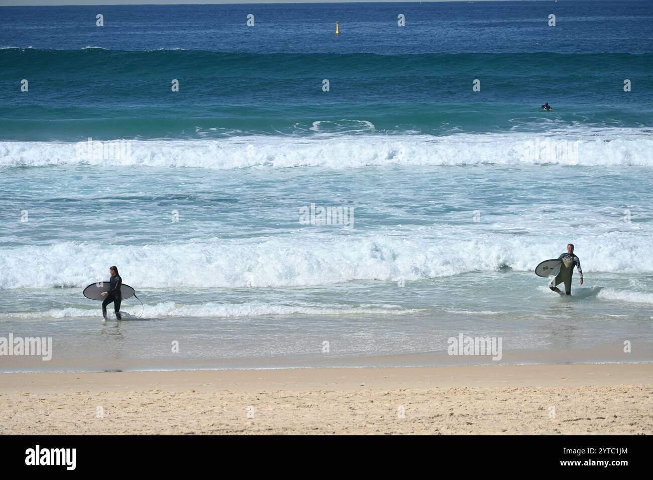 Surfers on Bondi beach, one of the most popular spots for surfing in ...