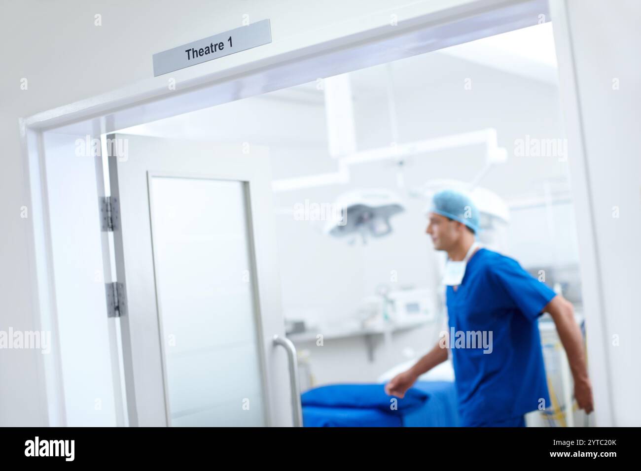 Doctor, surgery and theatre with man in hospital for healthcare ...