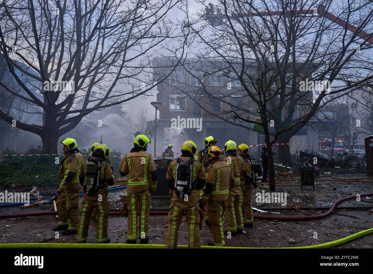 Firefighters work at the sight of an explosion at an apartment block in ...