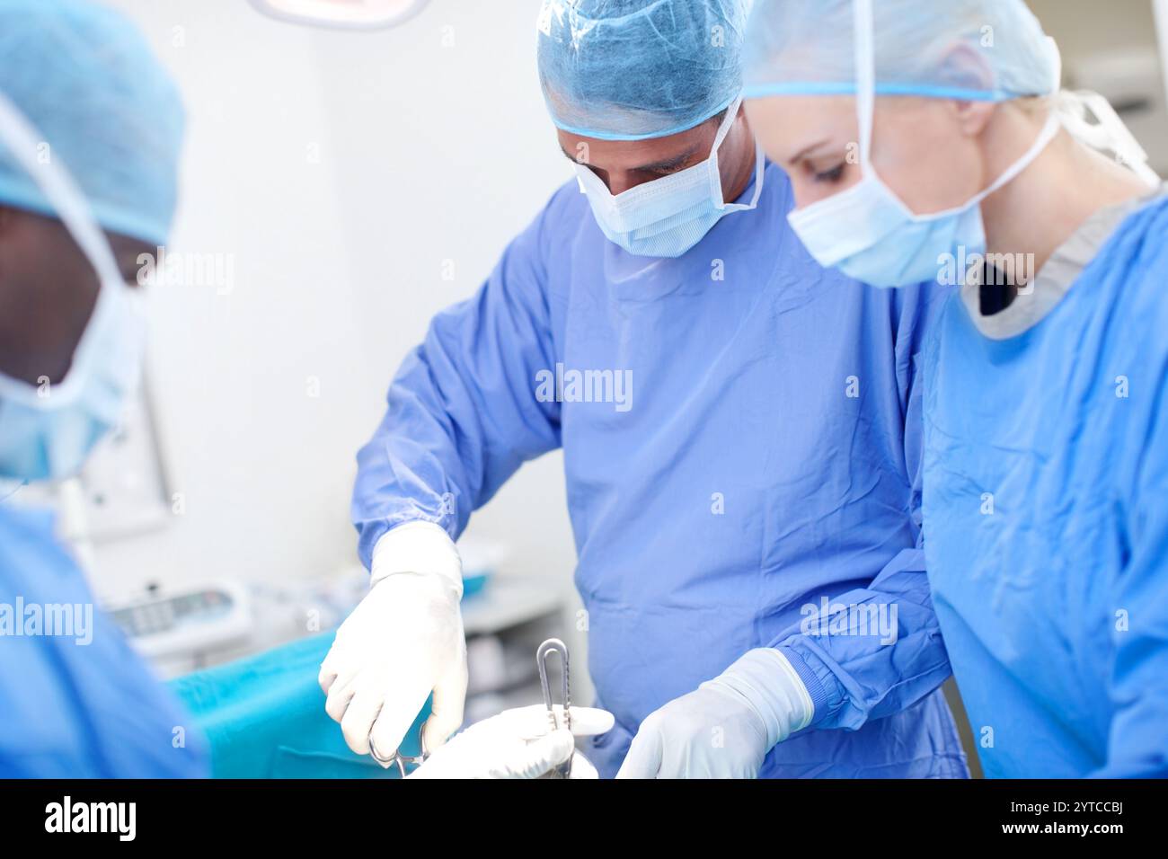 Surgery, teamwork and doctors in operating room for emergency medical ...