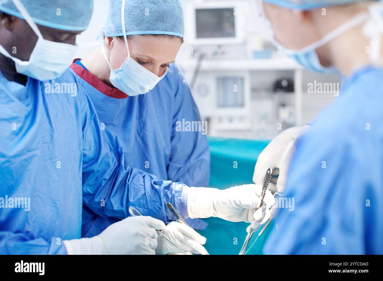 Surgery, teamwork and doctors in operating room together for emergency ...