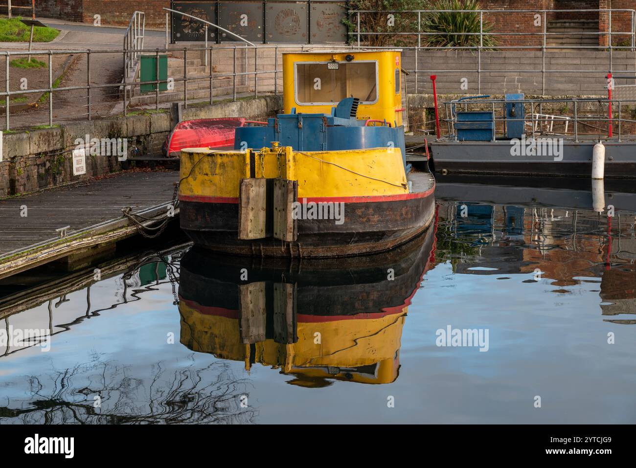 Brightly painted tug boat moored on Chichester canal. December 2024 ...
