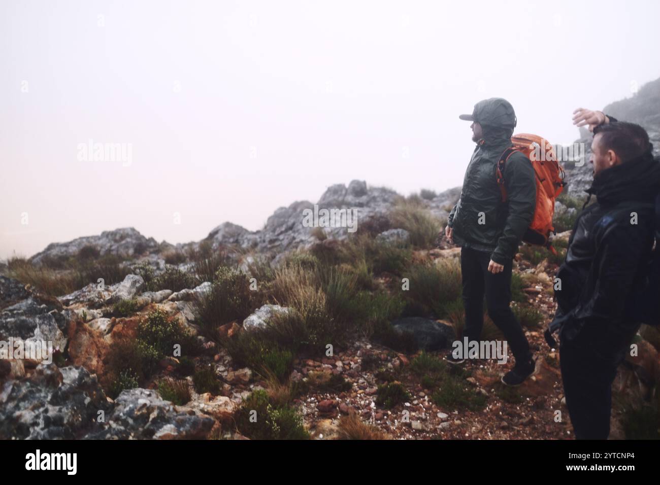 People, hiking and outdoor mountain for view, extreme terrain and ...