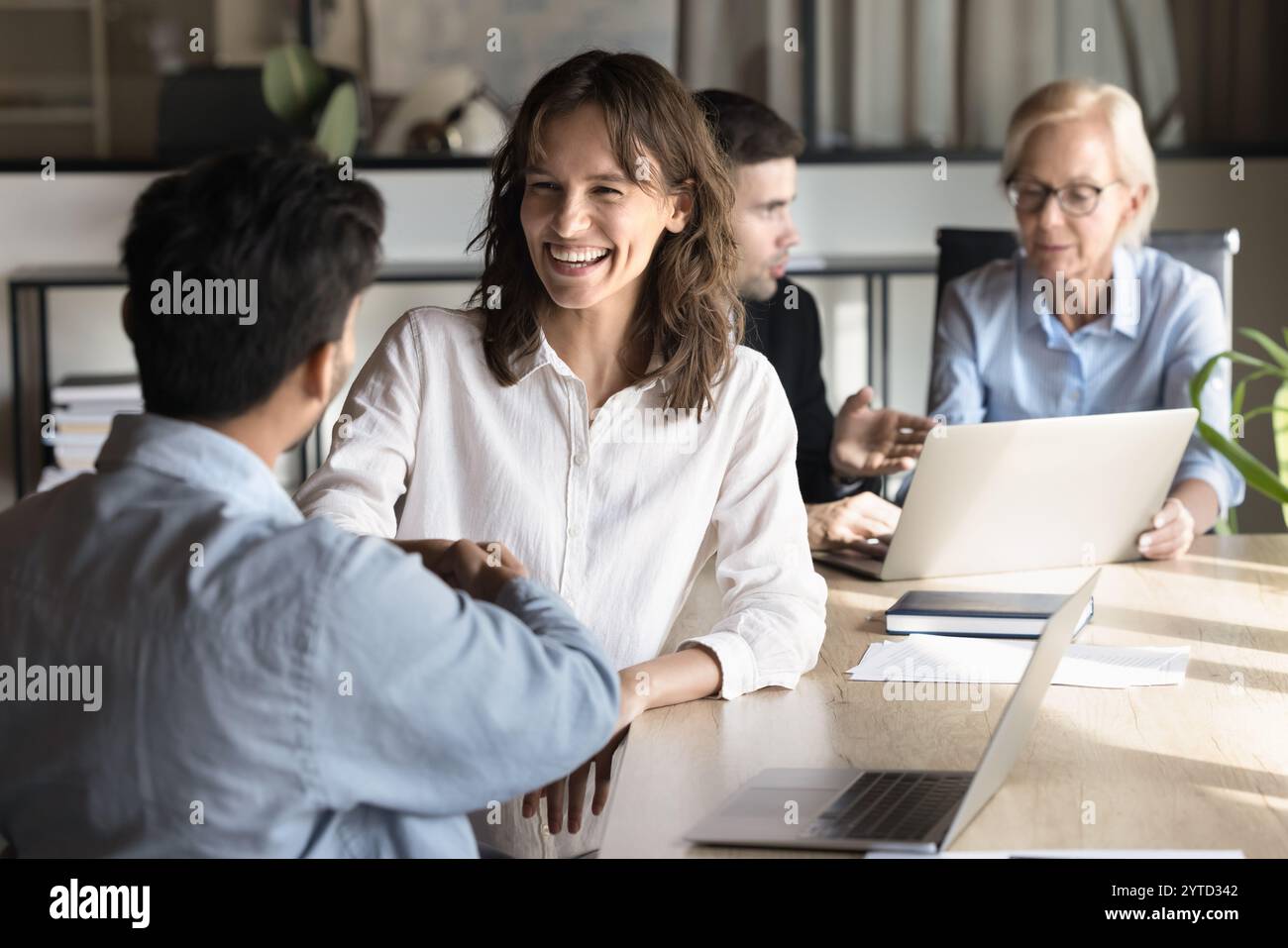 Two happy teammates finish teamwork, joint project completion with ...