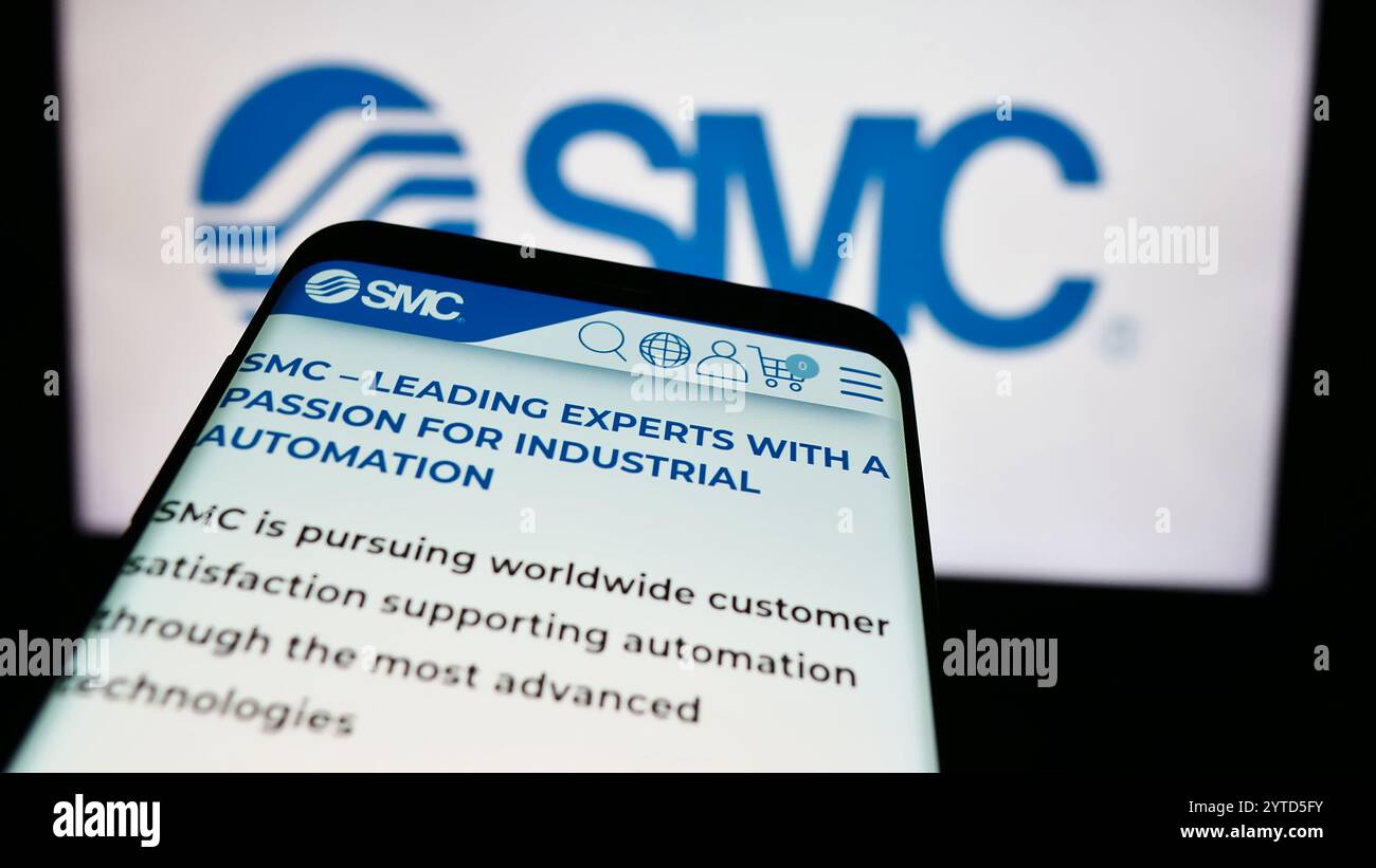 In this photo illustration, a mobile phone with the website of Japanese machinery company SMC ...