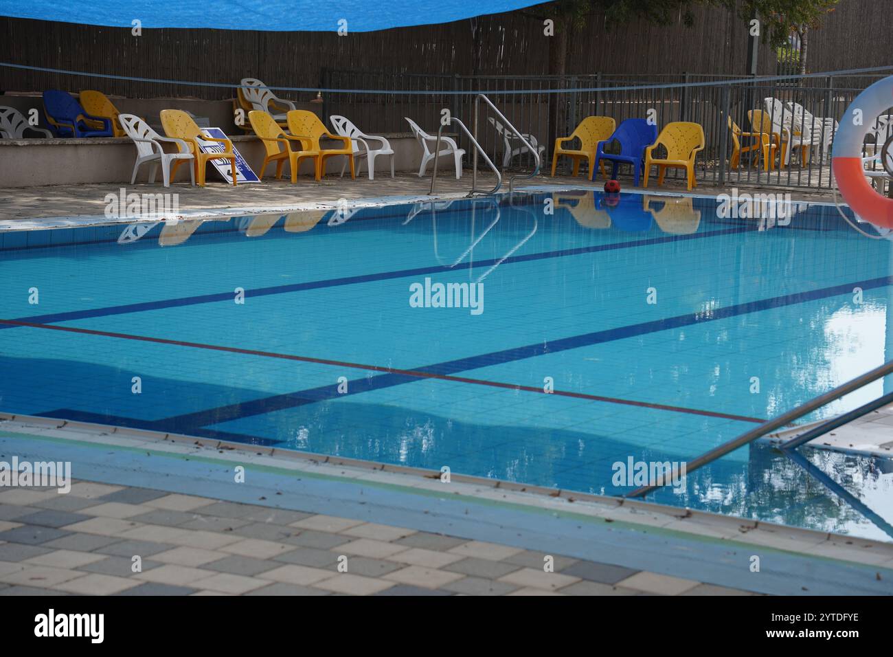 Outdoor swimming pool with blue water on a sunny day Stock Photo - Alamy