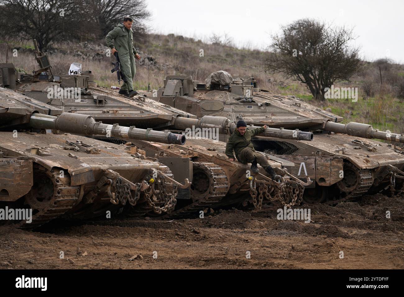 Israeli soldiers get off an armoured vehicle near the so-called Alpha ...