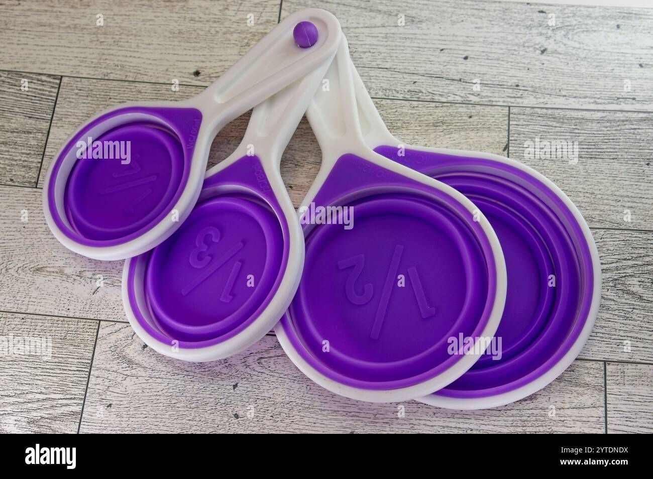 Silicone measuring cups on countertop Stock Photo - Alamy
