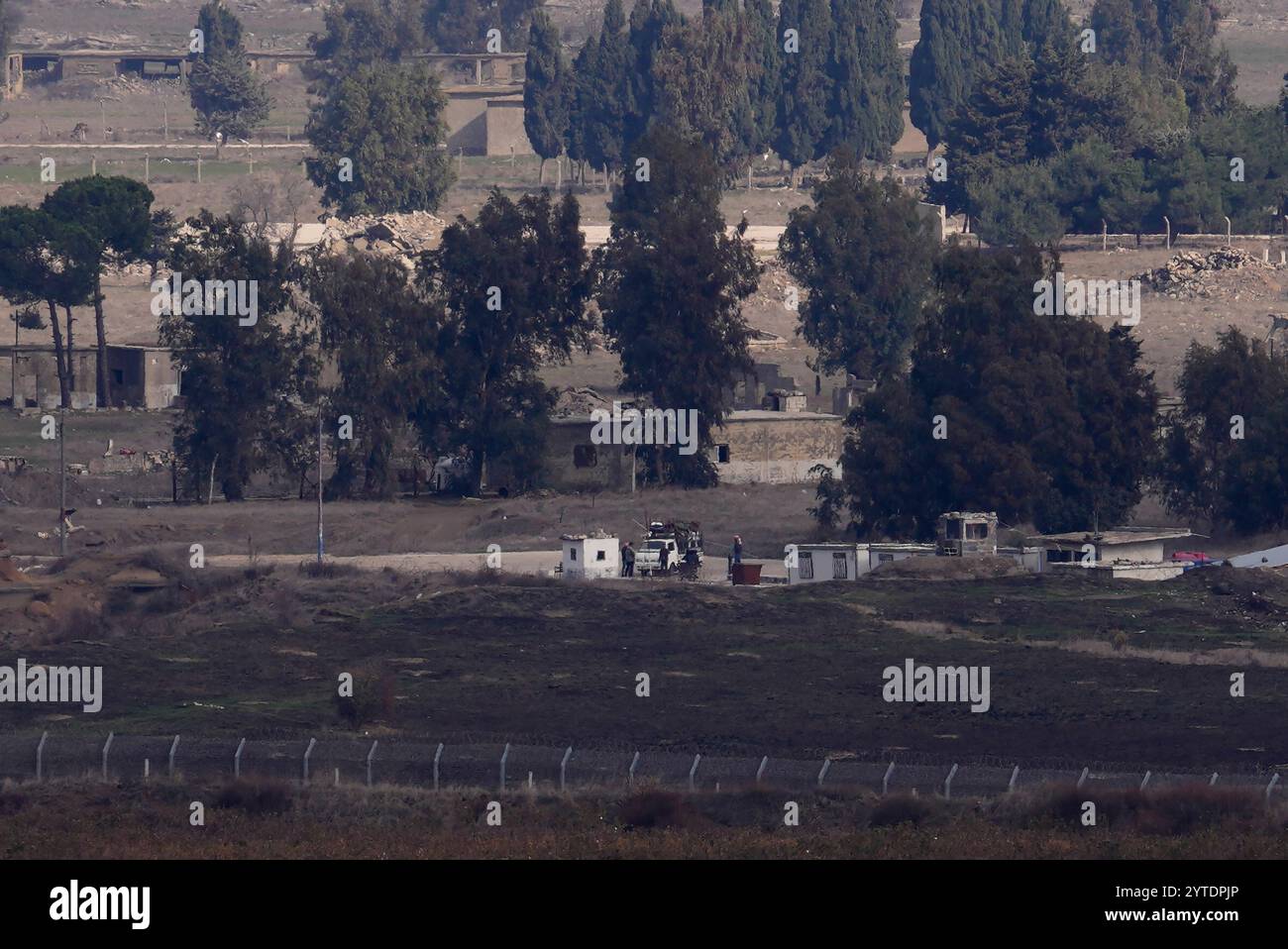 A loaded van sits at a post on the Syrian side of the so-called Alpha ...