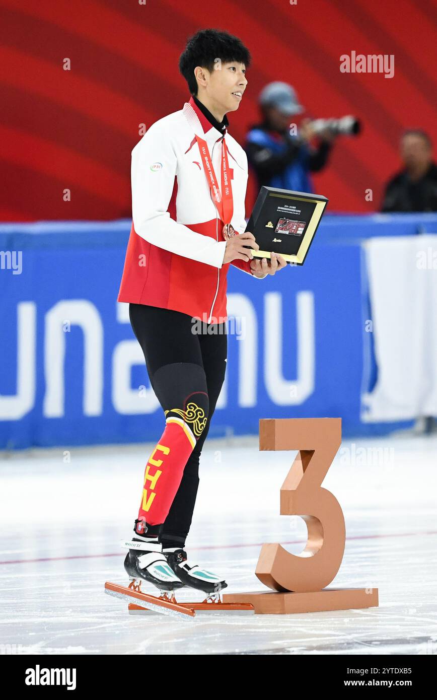 Beijing, China. 7th Dec, 2024. Bronze medalist Sun Long of China poses ...