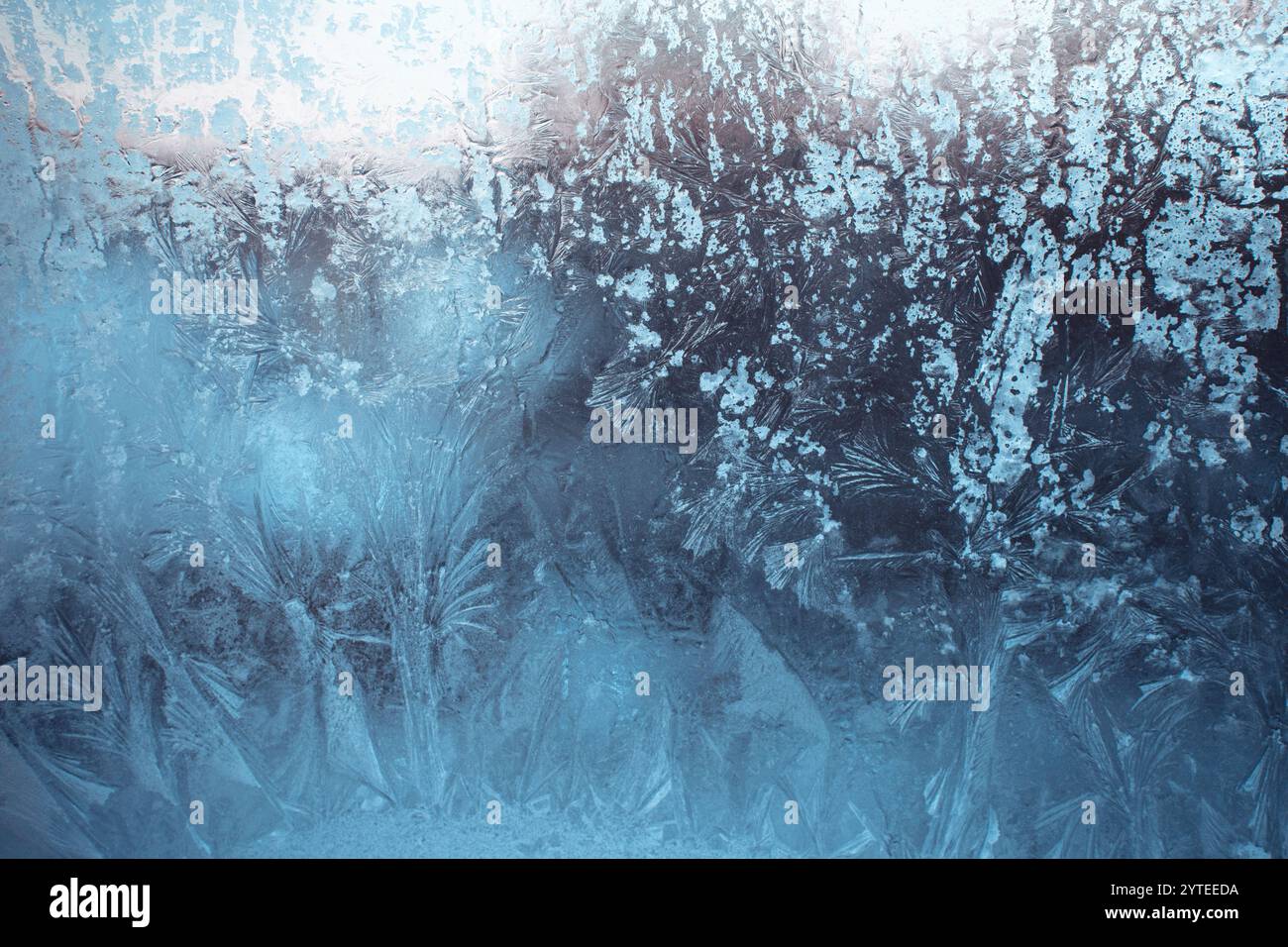Blue winter background with frost pattern on the window. Beautiful ...