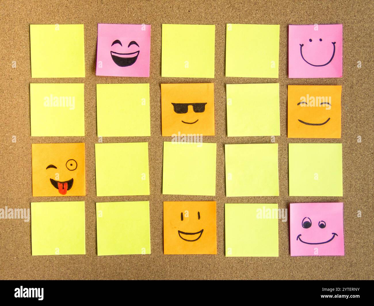 self adhesive office notes with different face expression on cork board ...