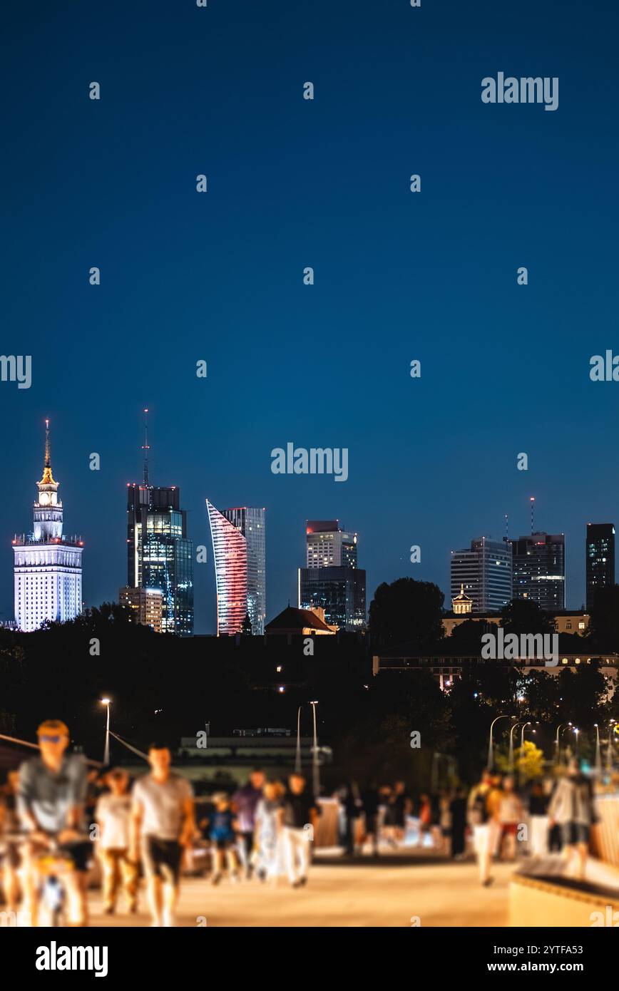 night over skyline of Warsaw city with skyscrapers and downtown ...