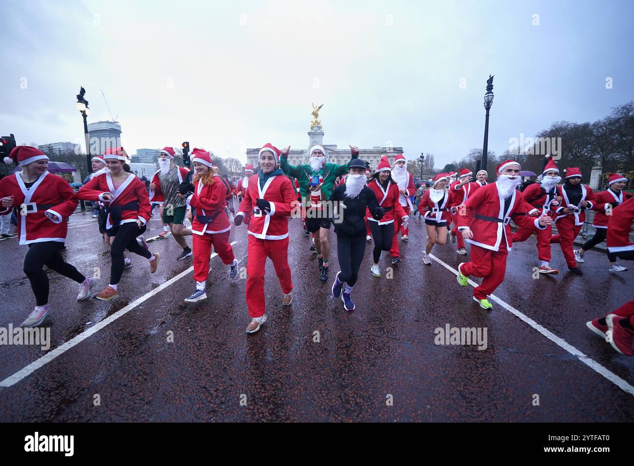 People take part in the Scrambled Legs Running Club 10k Santa Run in ...