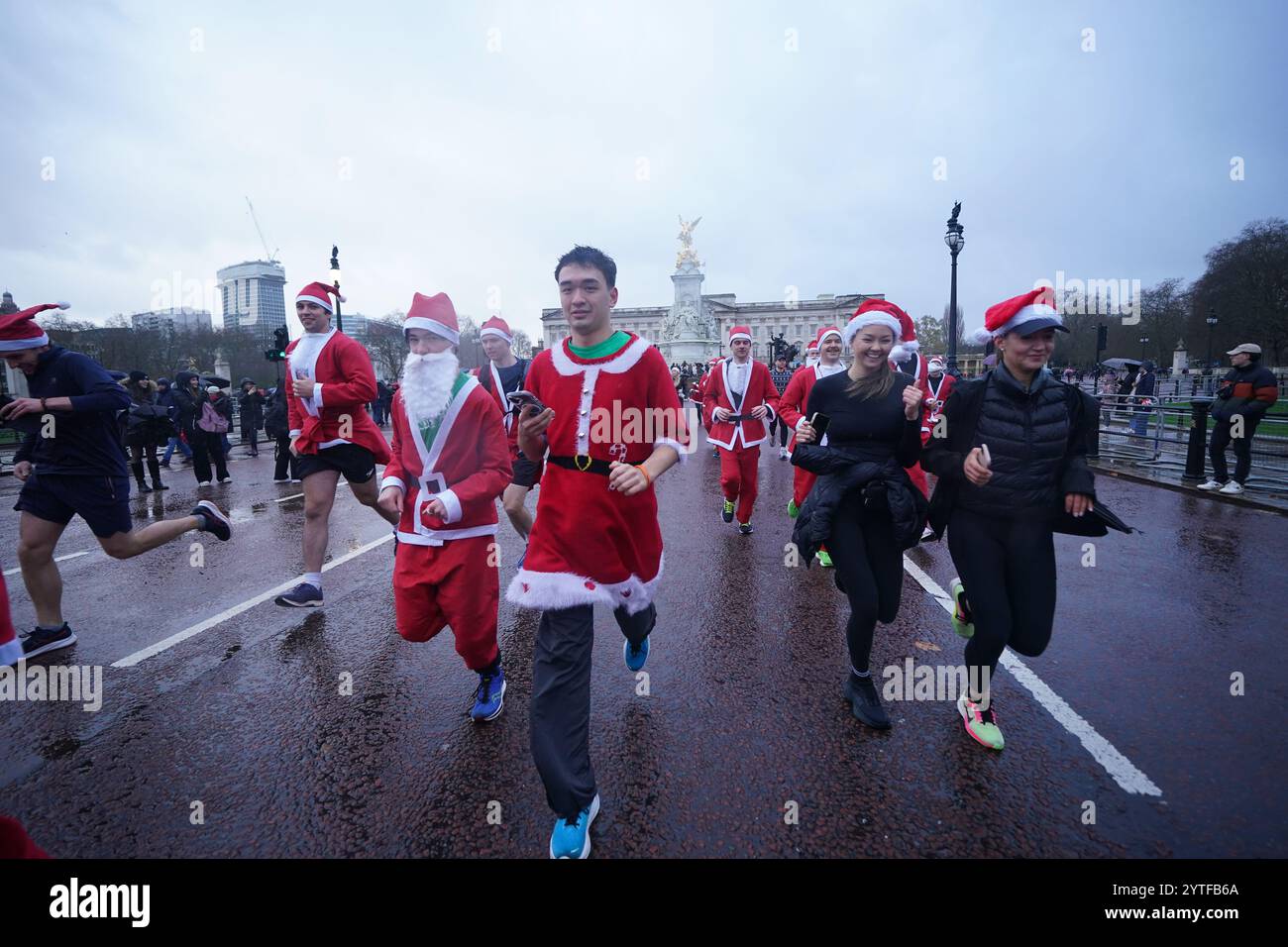 People take part in the Scrambled Legs Running Club 10k Santa Run in ...