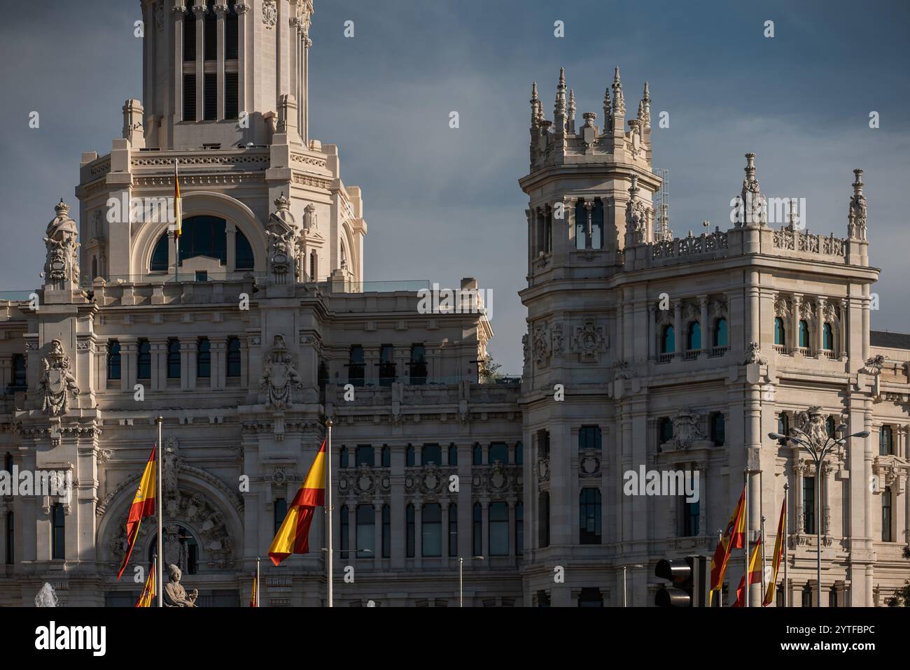 Madrid city hall with Spanish flags at sunset, Ayunmtamiento building ...