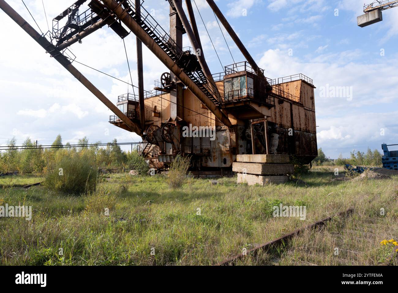 Abandoned Rusty Excavator Surrounded by Overgrown Grass and Trees Stock ...