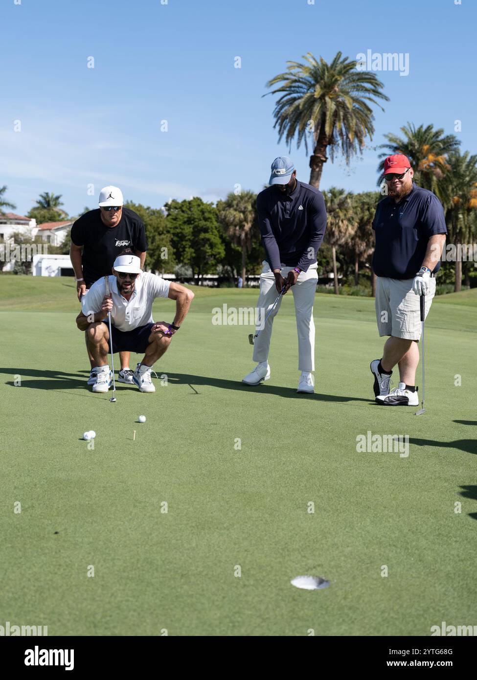 Michael Phelps, Eric Dantes, Dwyane Wade, and Luke Combs read the green ...