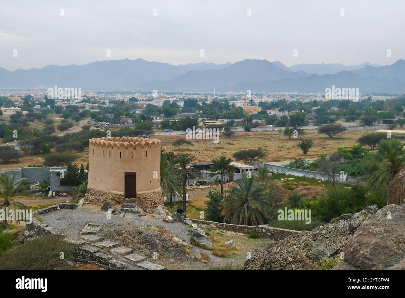Watch Tower on blurred cloudy mountains background next to historical ...