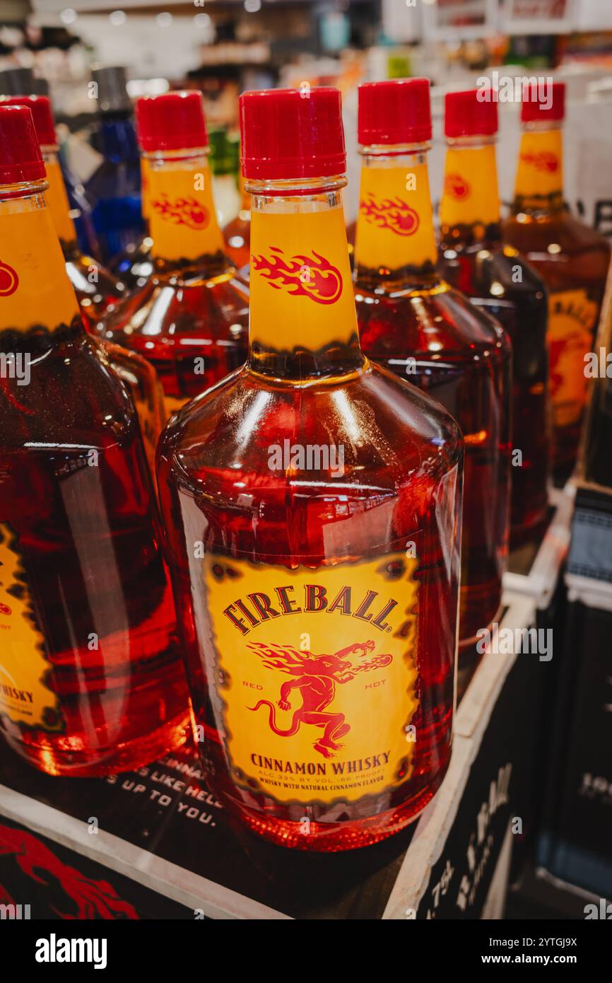Shiloh, IL—Oct 12, 2024; illuminated bottles of Fireball cinnamon ...