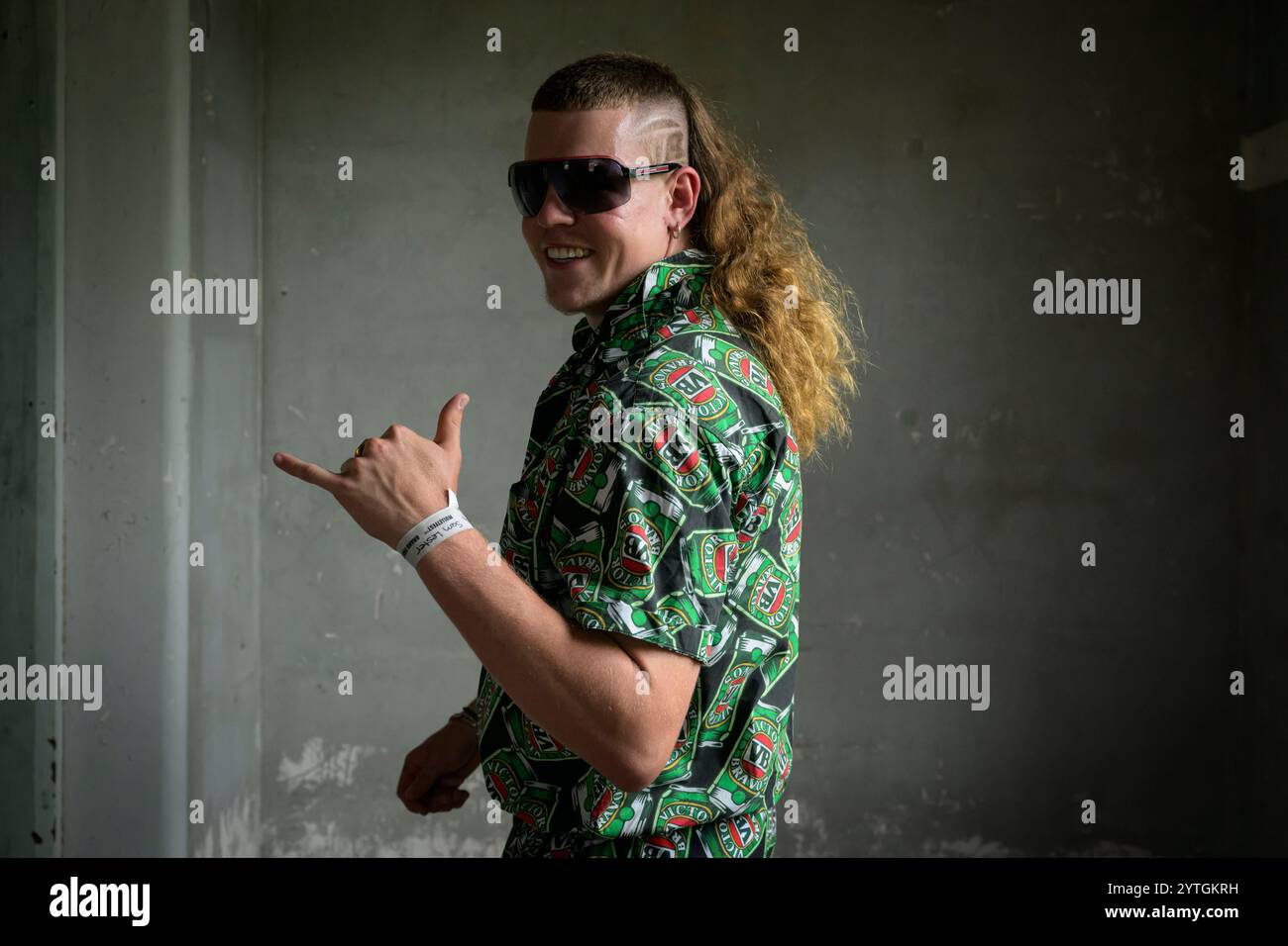 Contestant seen poses for photos during the Mullet Fest Grand Final ...