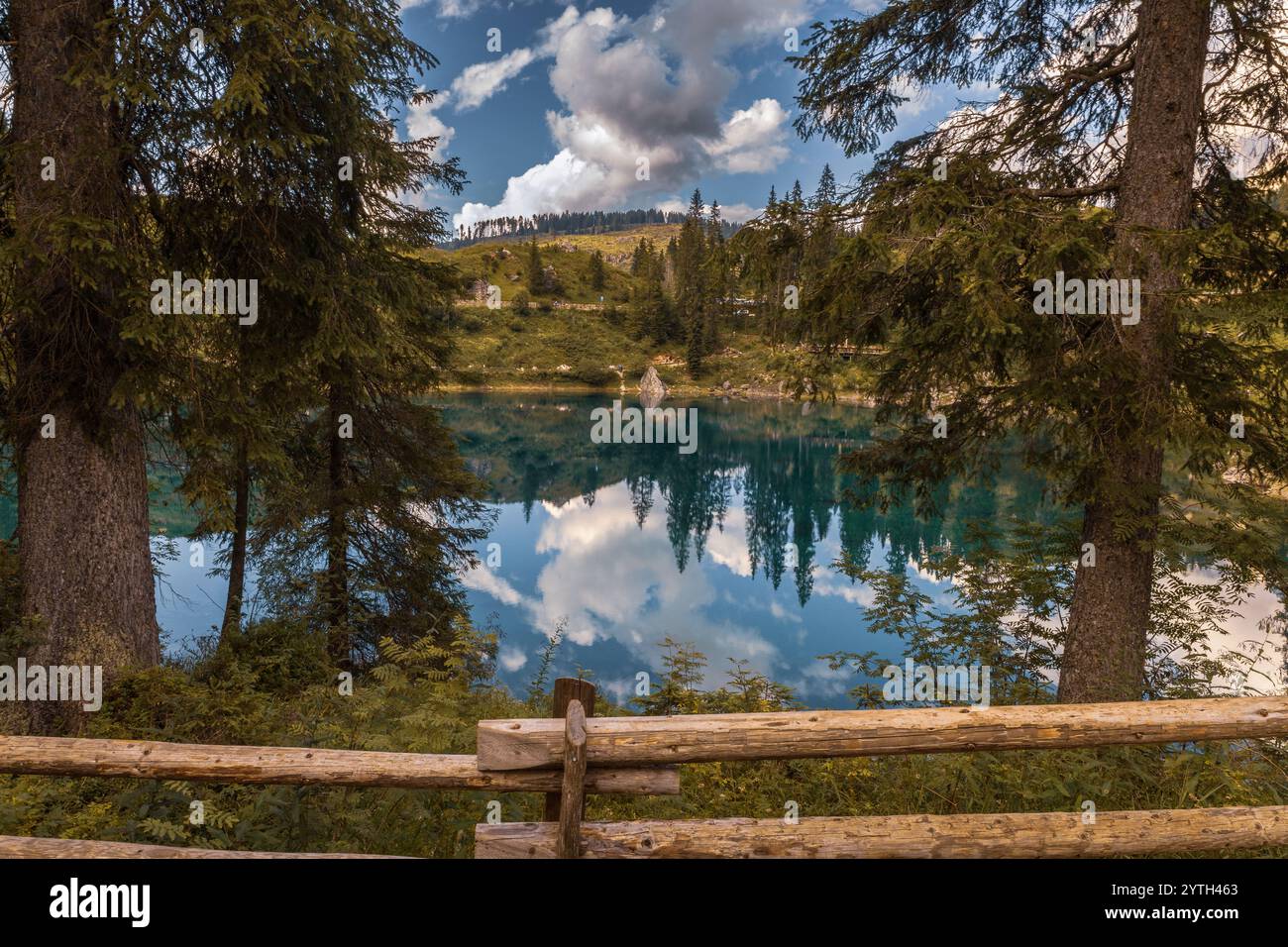Lake Carezza is a small alpine lake in the Dolomites, italy Stock Photo ...