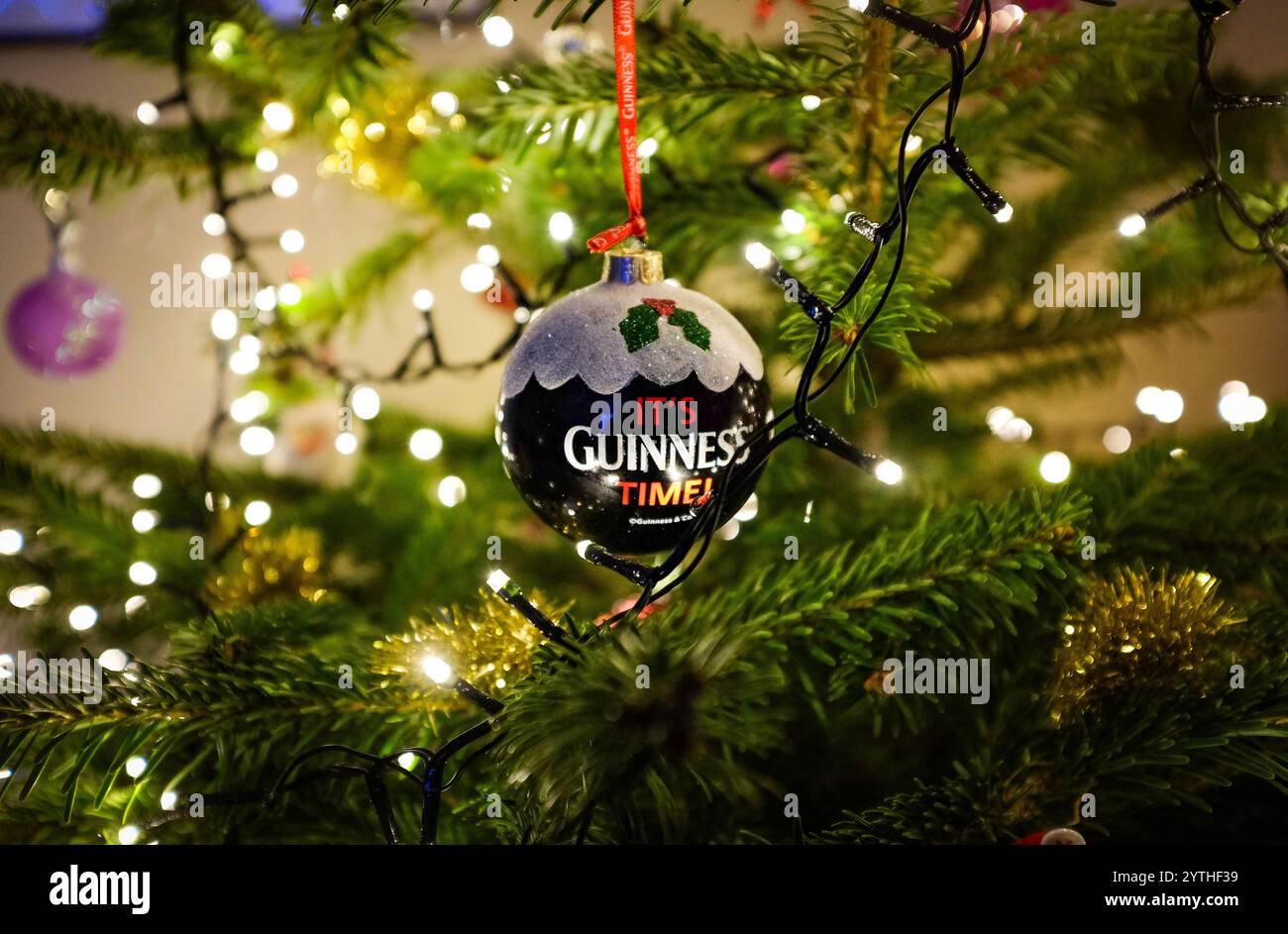 Real Fir Christmas tree with lights and a It's Guinness Time bauble ...