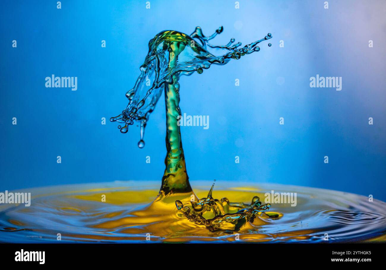 Arresting ethereal colour infused imaginative water collision macro ...