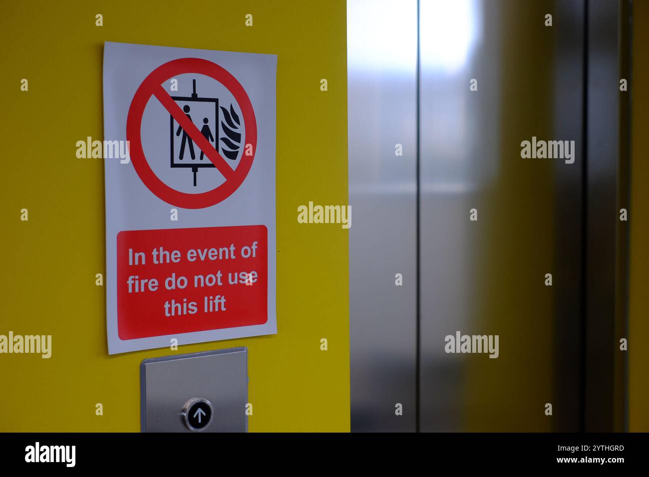 Fire safety do not use in the event of fire warning sign next to lift ...