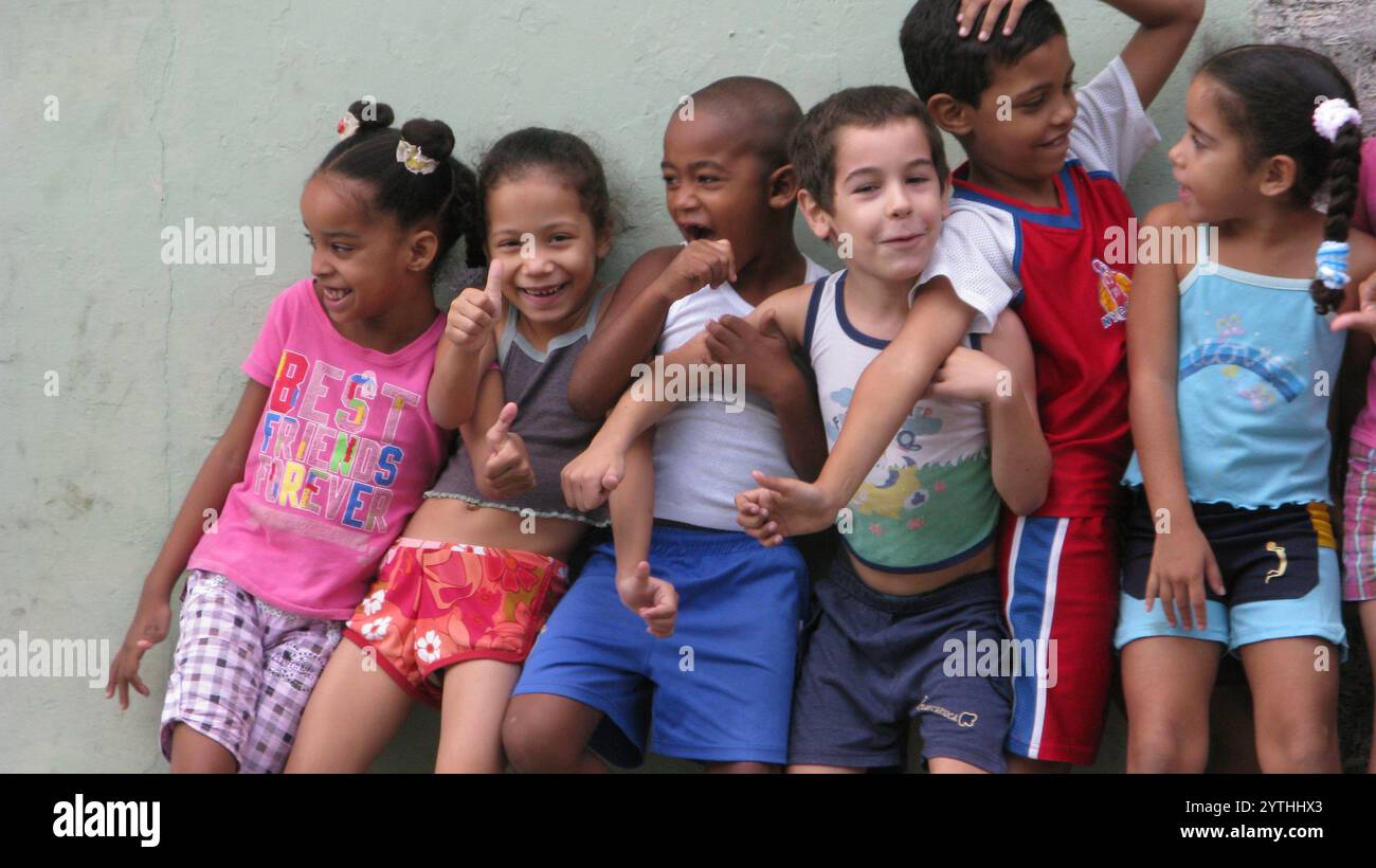 A group of Cuban Kids laughing at the street Stock Photo - Alamy