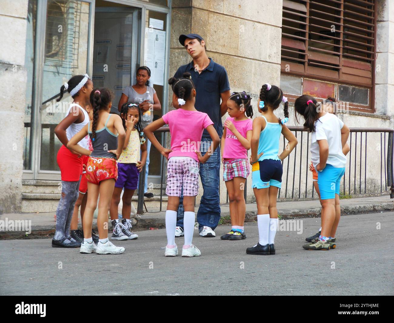 A teacher and students are in a physical class Stock Photo - Alamy