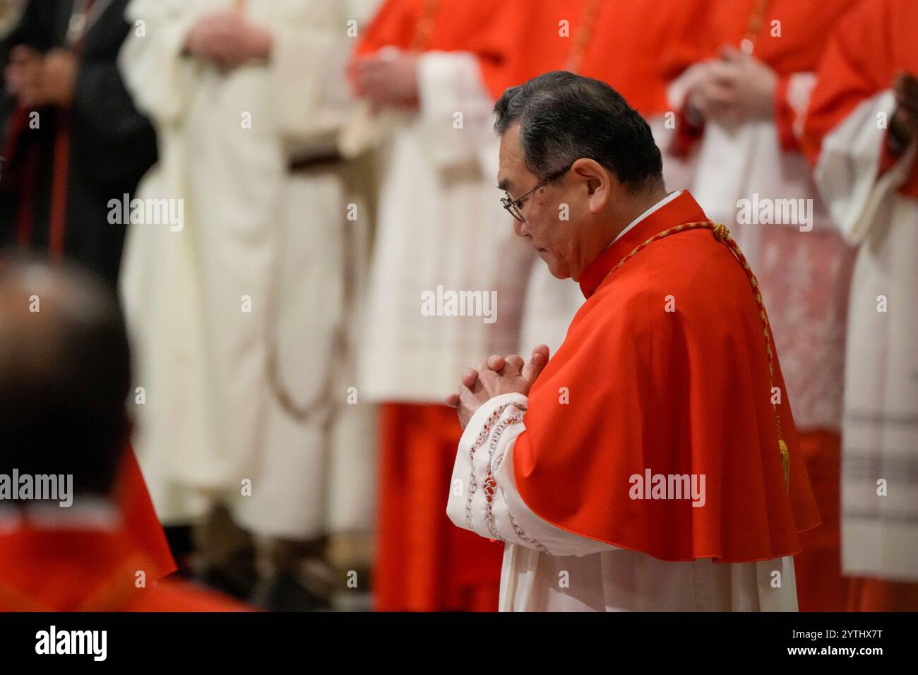 Tarcisio Isao Kikuchi, Archbishop of Tökyõ, Japan, right, prepares to ...