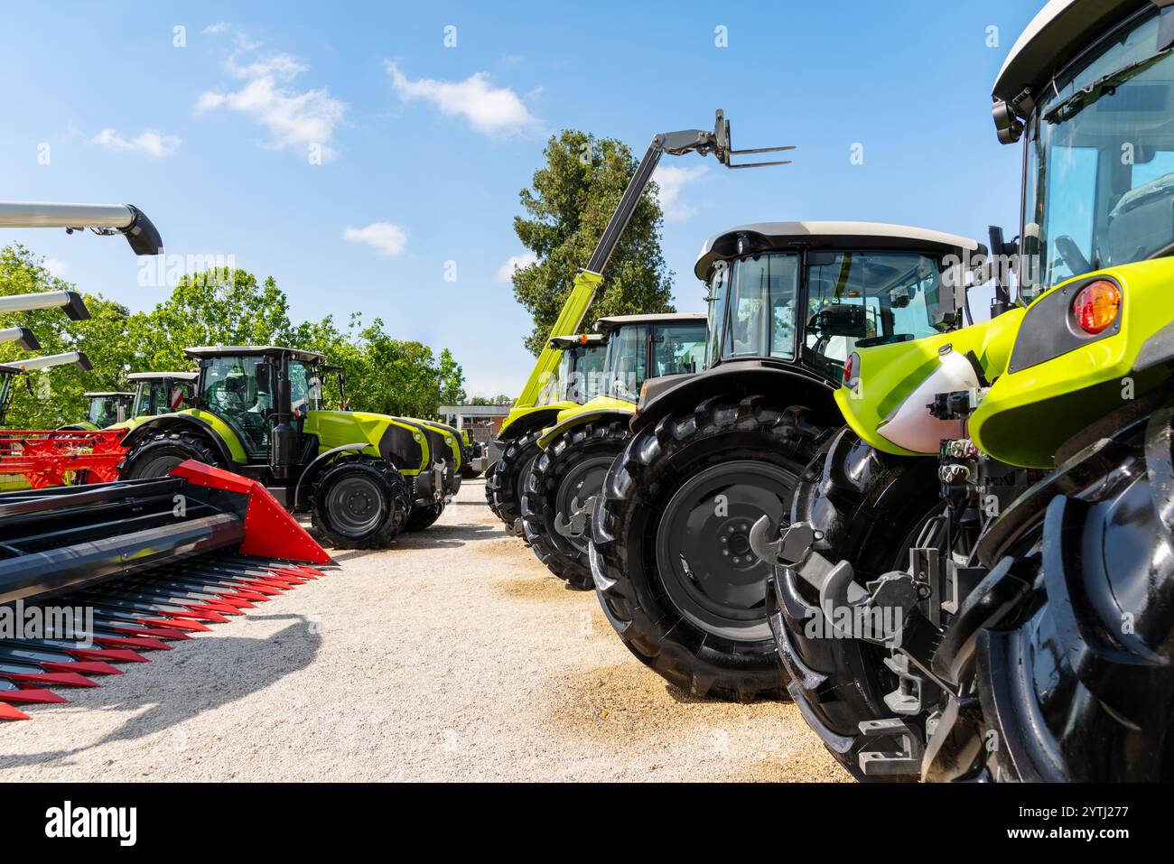 Agricultural machinery displayed at outdoor agri equipment dealership ...