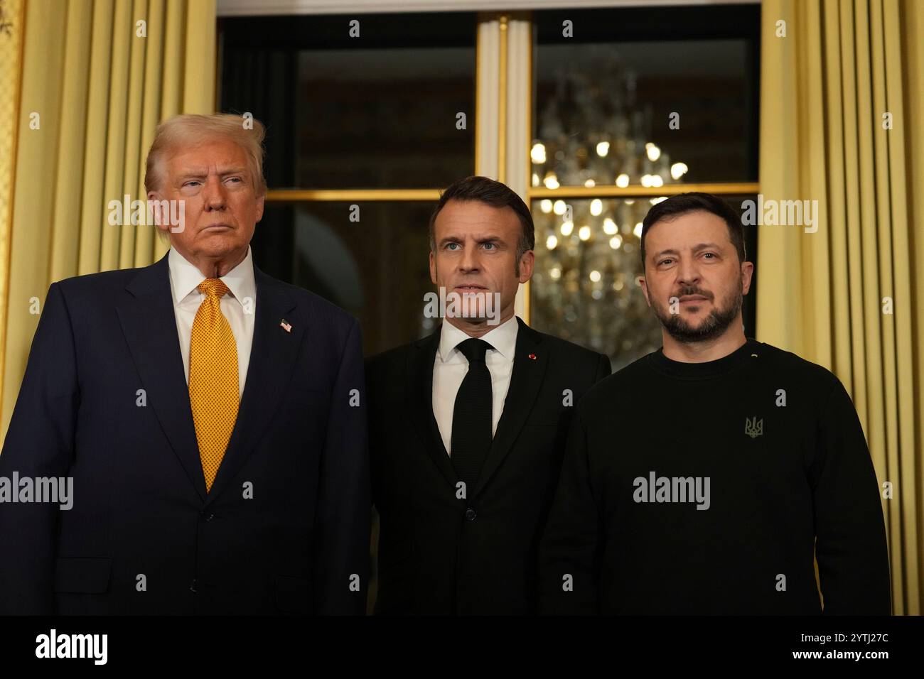 French President Emmanuel Macron, center, poses with President-elect ...