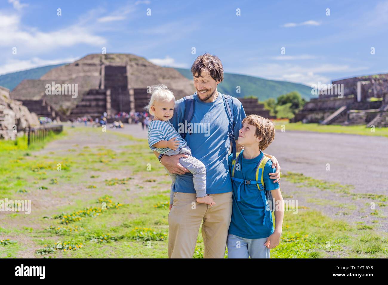 Father with his toddler and teenage sons exploring Teotihuacan, Mexico ...