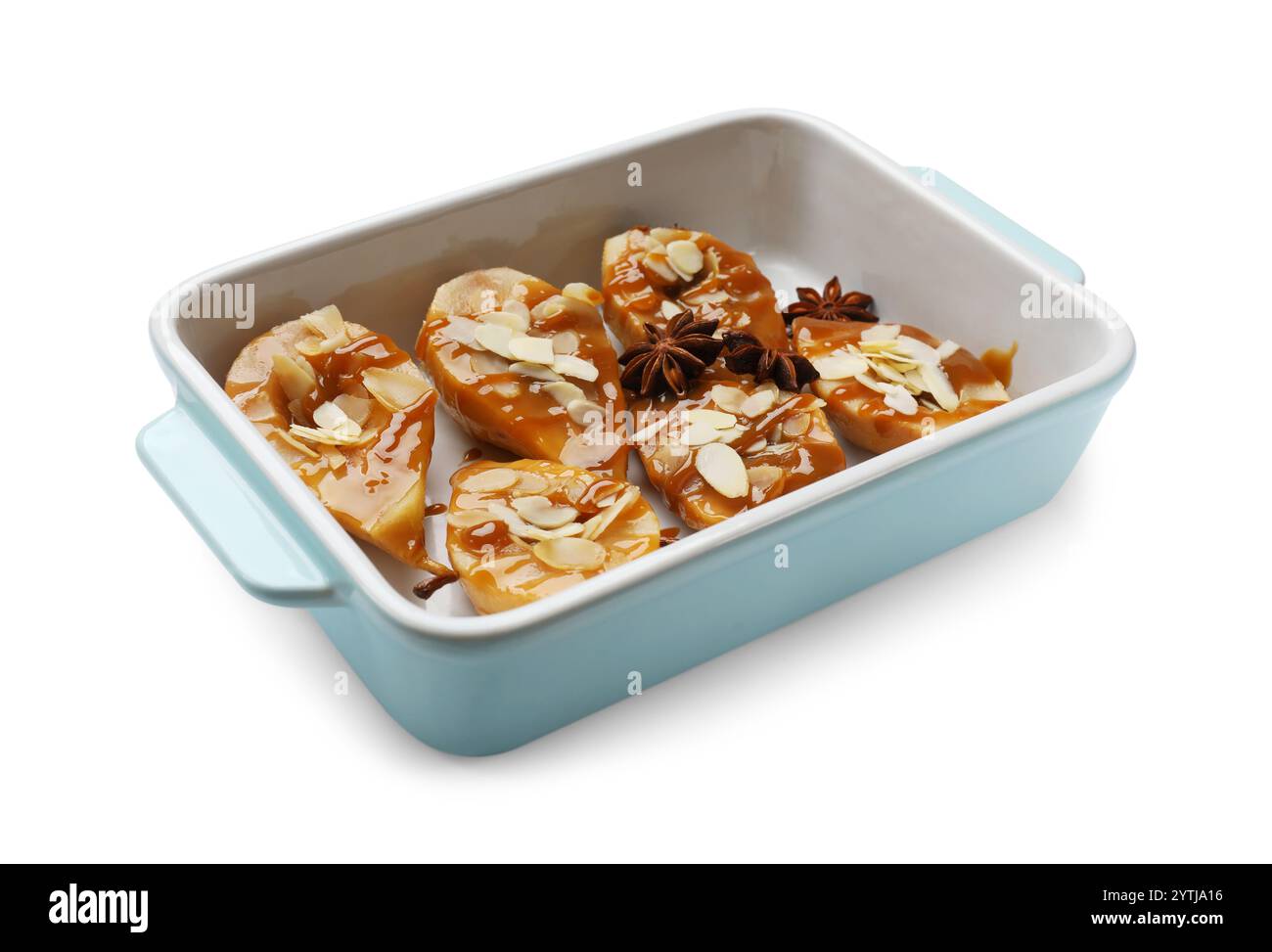 Delicious pears with caramel sauce, almond flakes and anise stars in ...